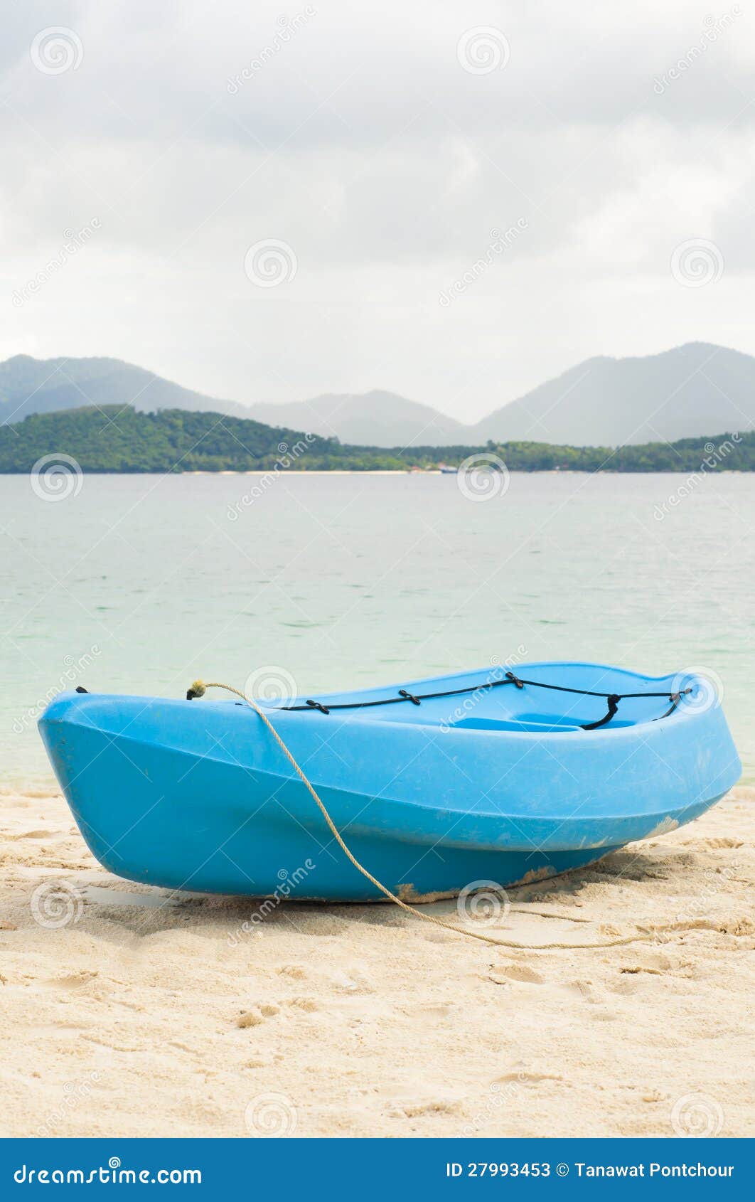 Blue Canoe With Floating Paddles In The Emerald Lake With Islands And ...