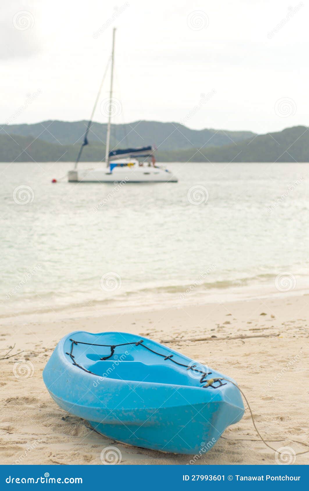 Blue Canoe With Floating Paddles In The Emerald Lake With Islands And ...