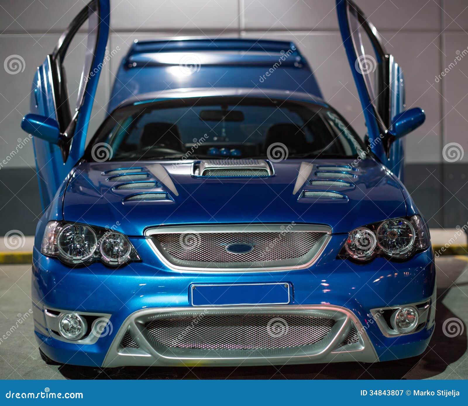 Blue car with angel wings stock image. Image of door - 34843807