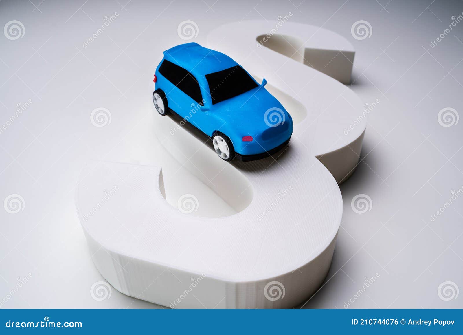 Blue Car Model on White Paragraph Sign Over White Backdrop Stock Photo ...