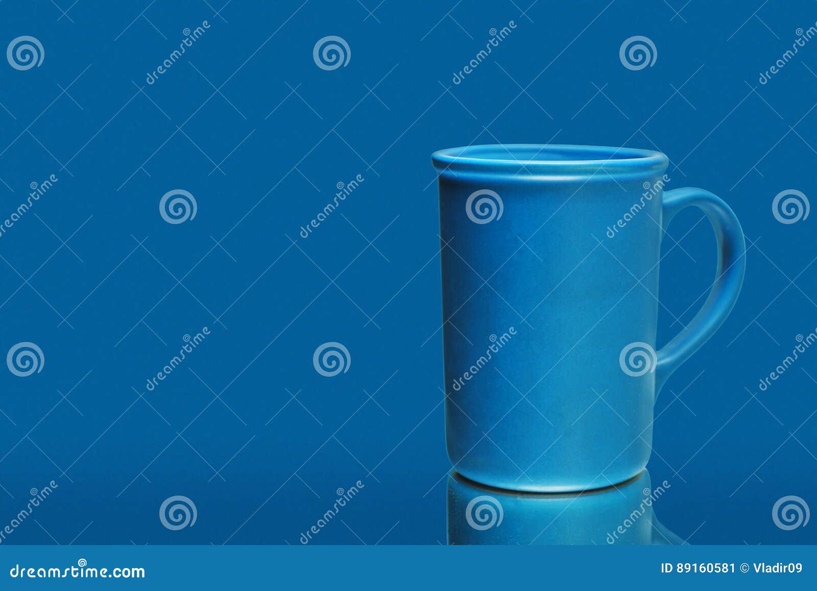 A Blue Ceramic Mug Over a Blue Background Stock Image - Image of shiny ...