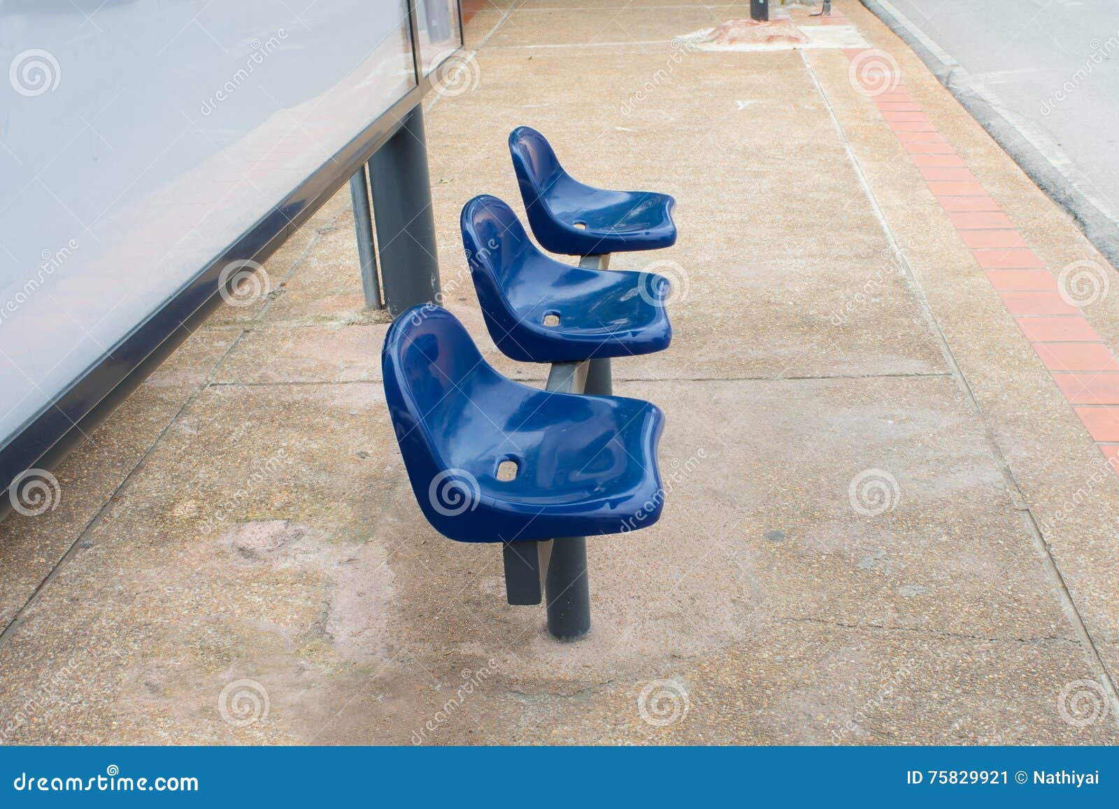 Blue chairs at bus stop stock image. Image of urban, public - 75829921