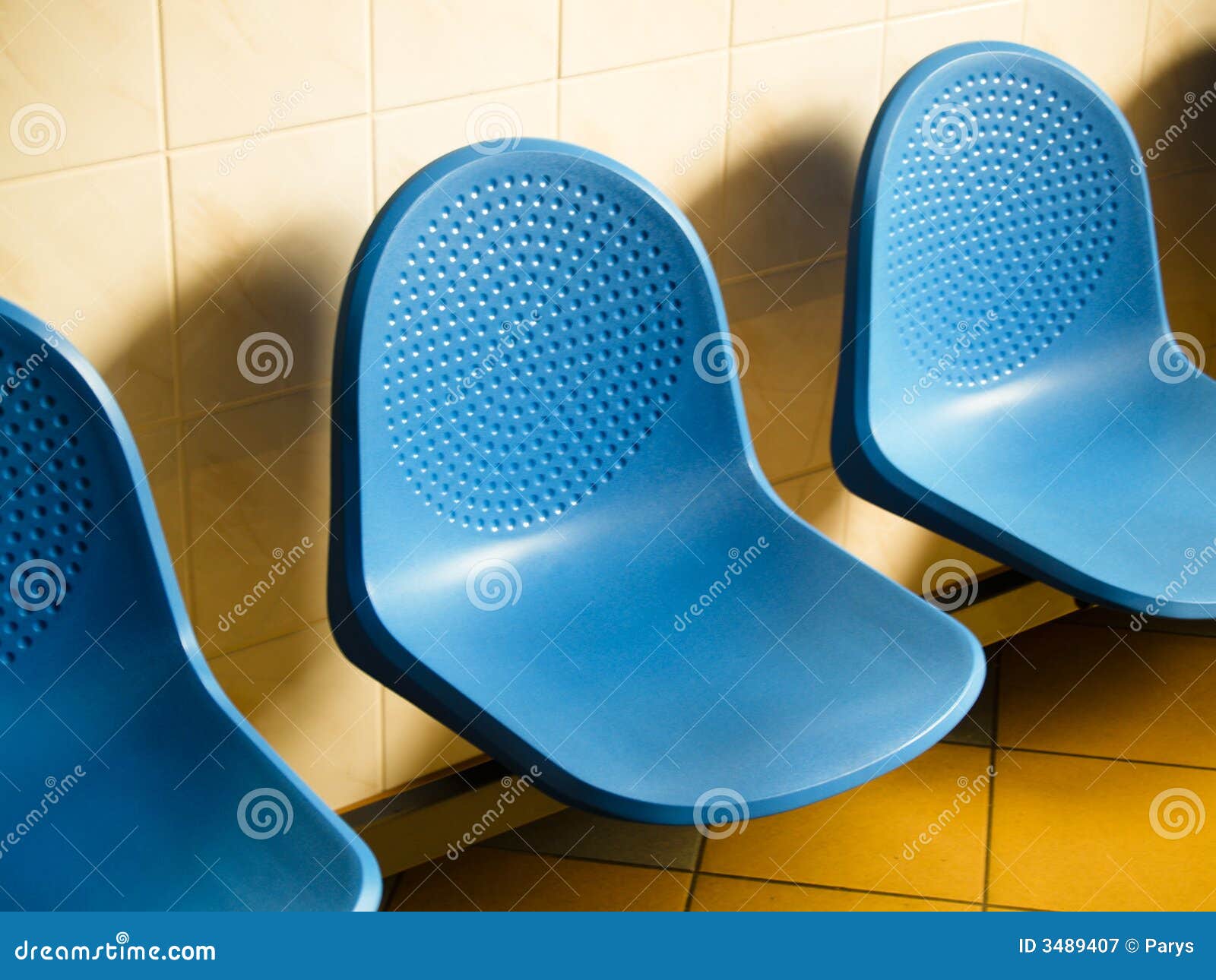 Blue Chairs in Waiting Room Stock Image - Image of spectators, folding ...