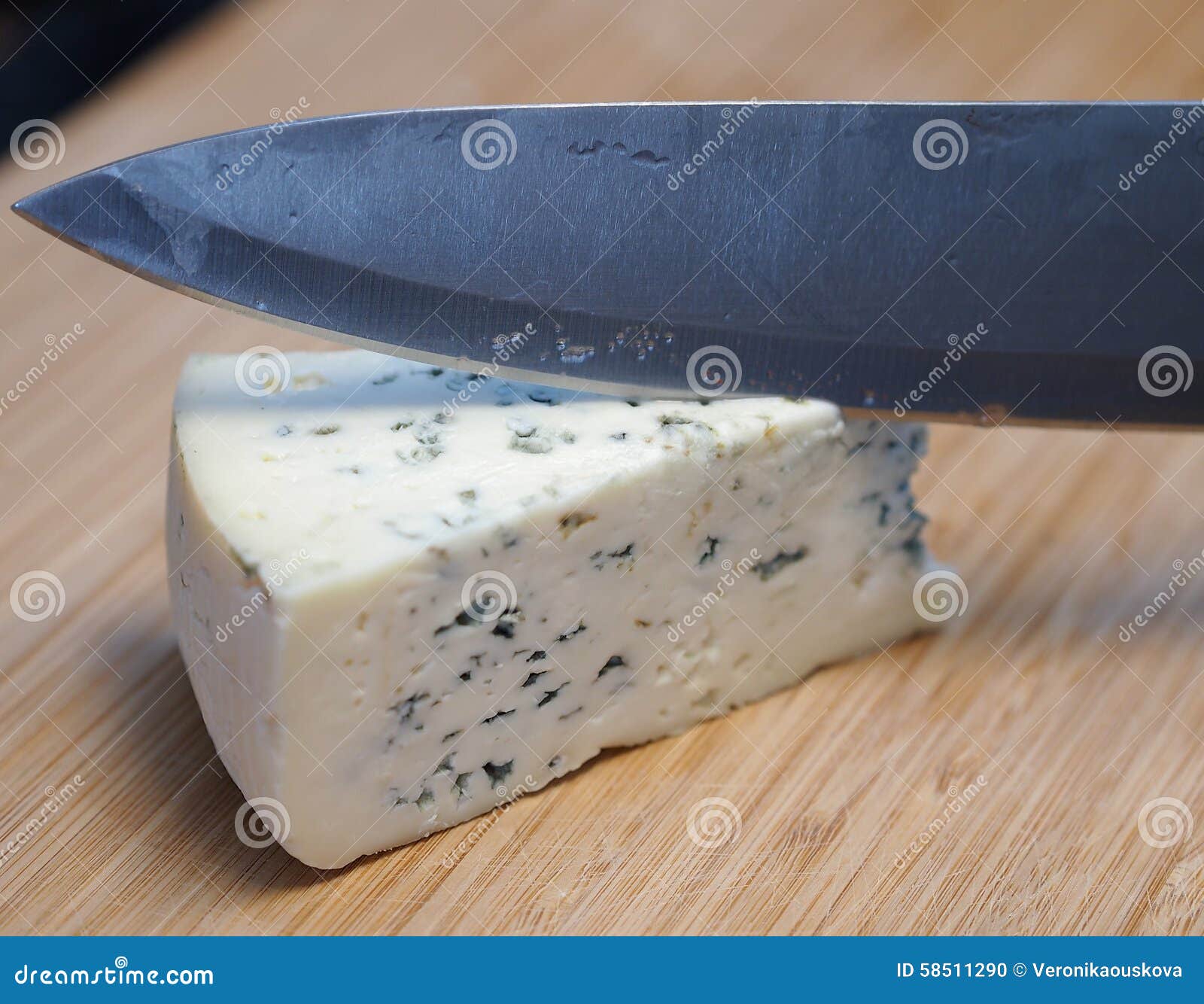 Blue cheese being cut stock photo. Image of kitchen, preparation - 58511290