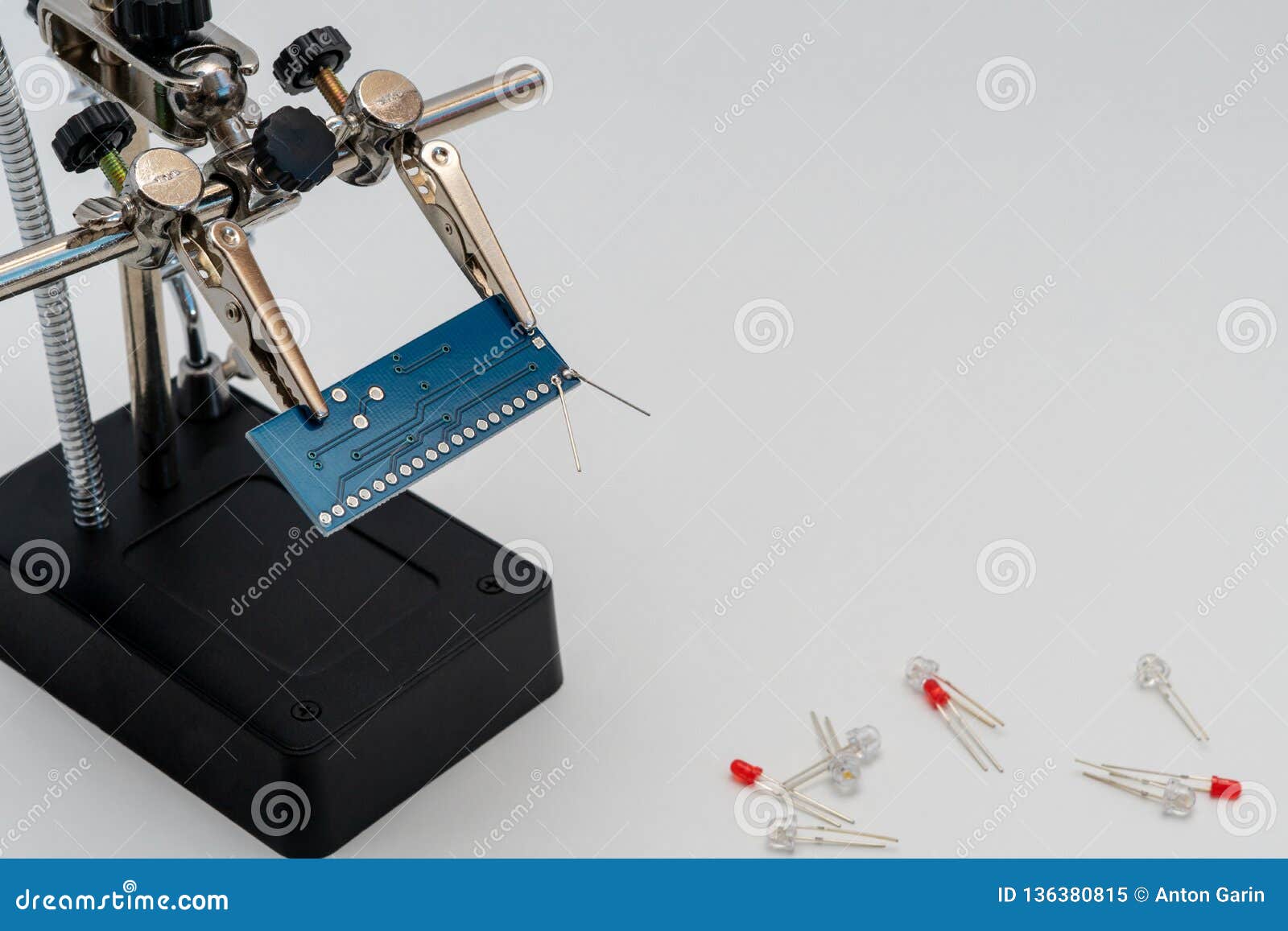 Blue Circuit Board in Soldering Helping Hands Stock Image - Image of ...