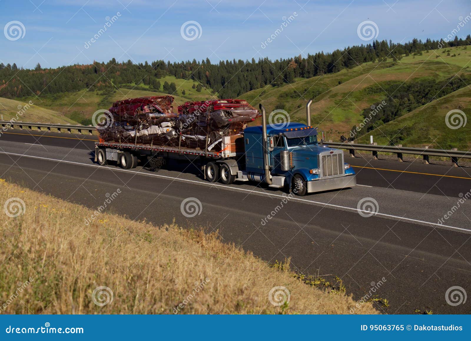 Loaded Big Rig Classic Semi Truck With Flat Bed Semi Trailer Standing ...