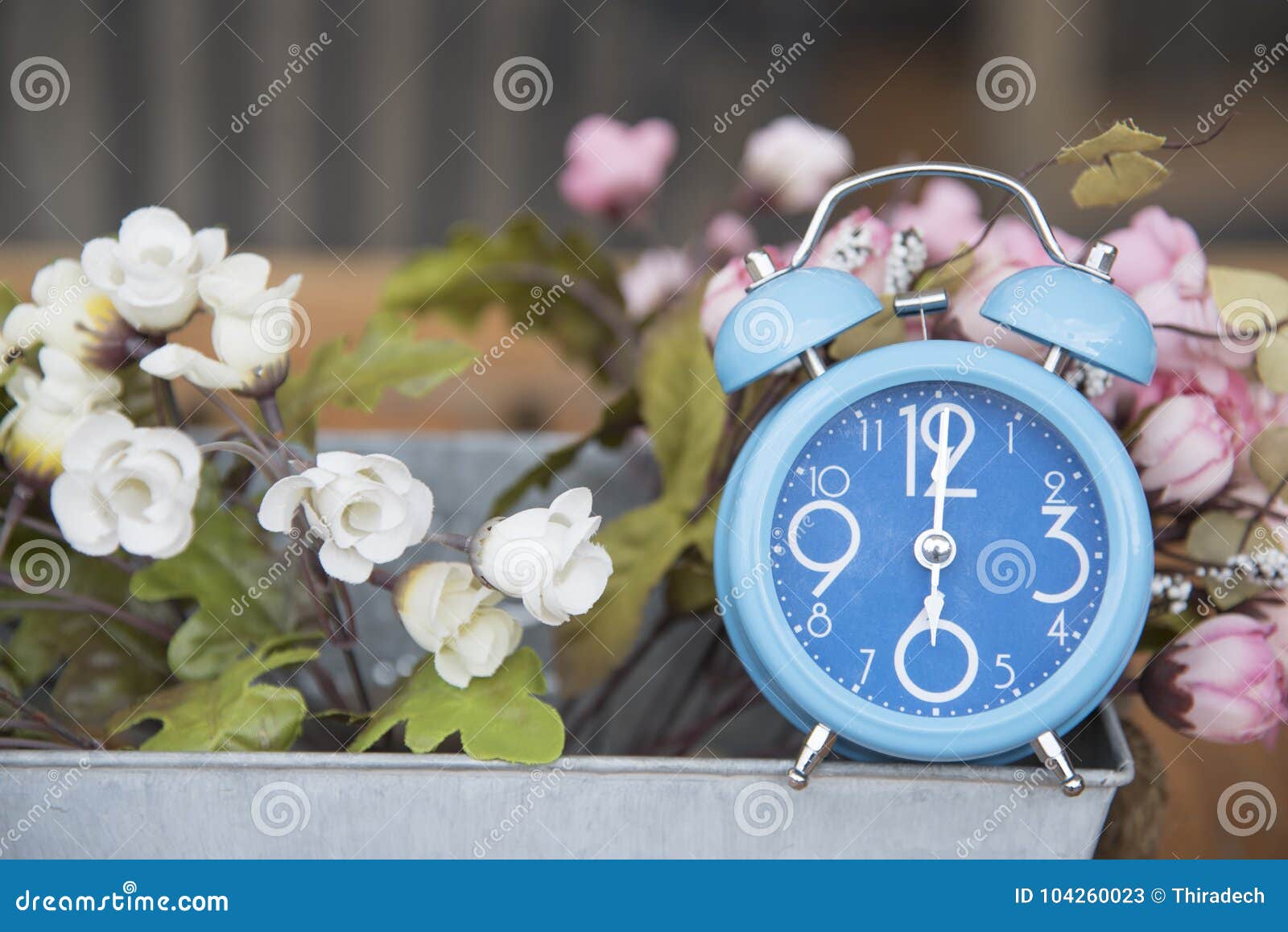 Blue Clock with Artificial Flowers Stock Image - Image of white ...