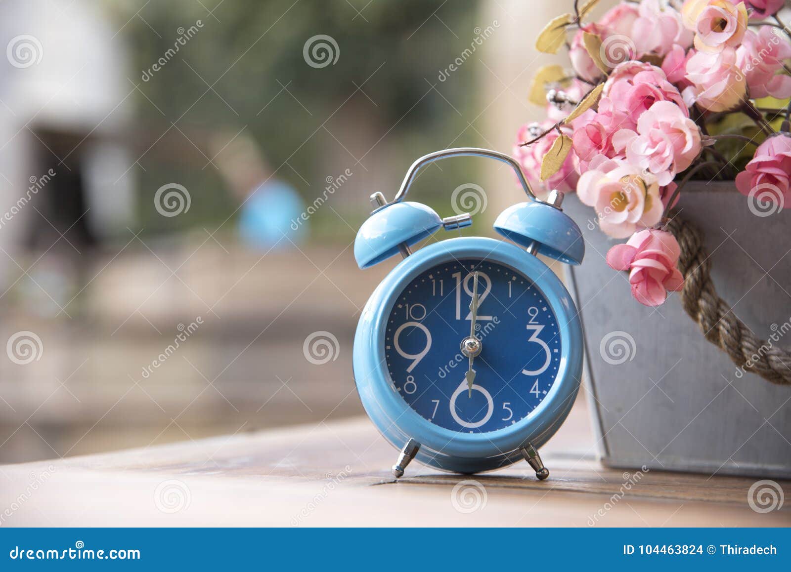 Blue Clock with Artificial Flowers Stock Photo - Image of clock ...