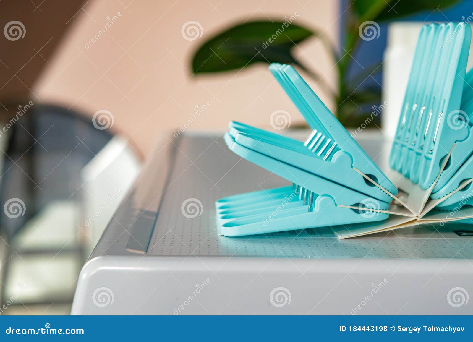 Blue Clothes Pins on White Washing Machine Stock Photo - Image of light ...
