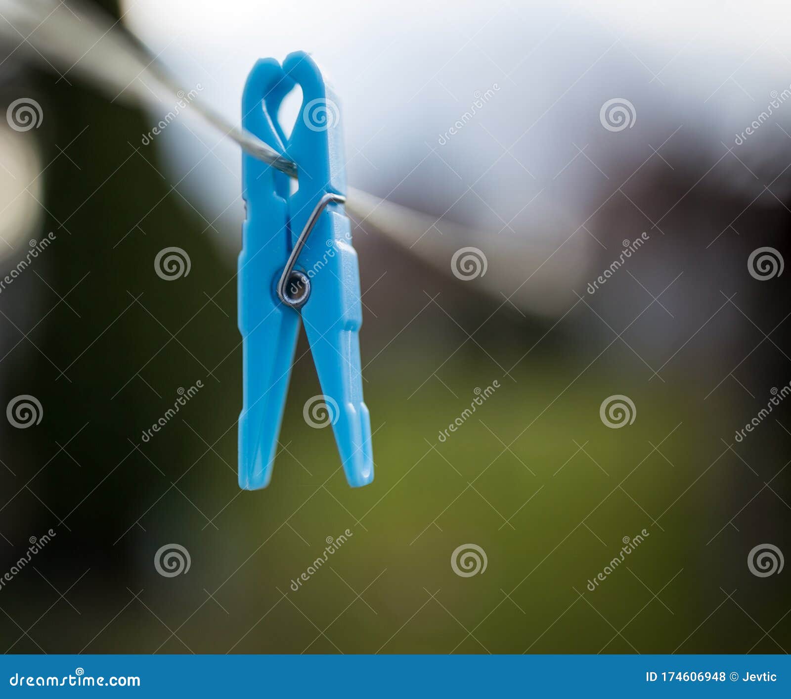 Blue Clothespin Hanging on Rope Stock Photo - Image of close, wire ...