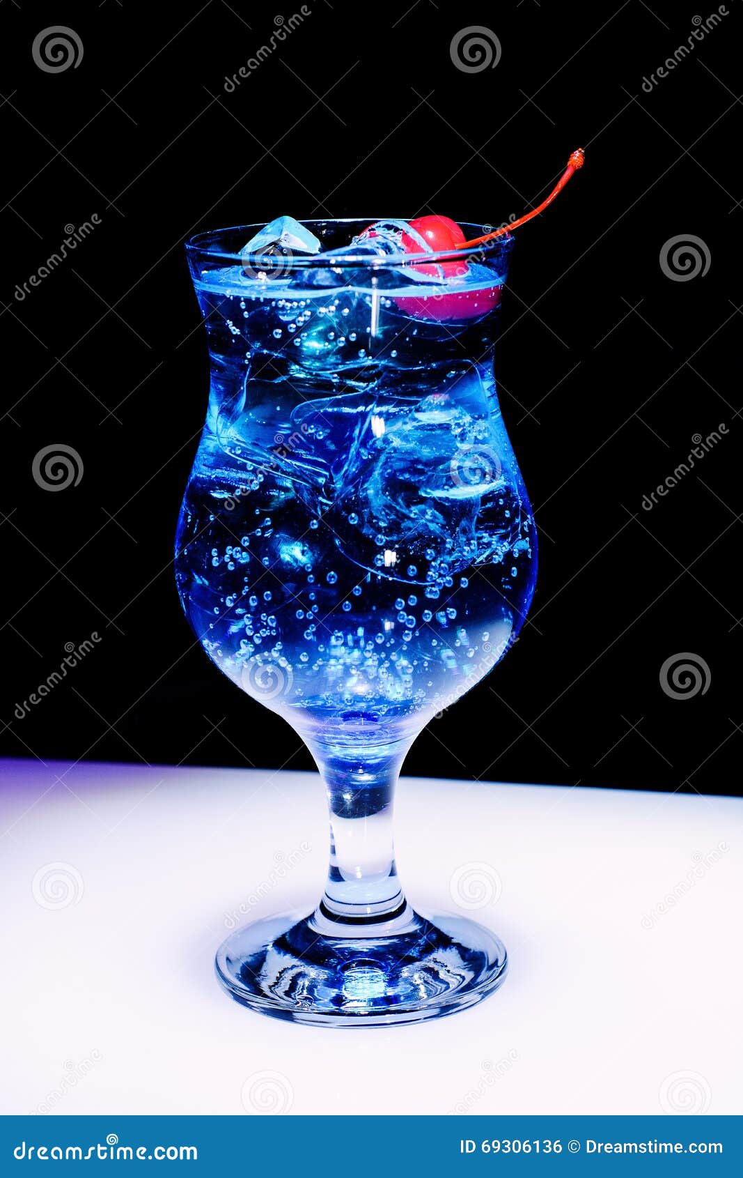 A Blue Cocktail with Ice and Cherry Stock Photo - Image of culture ...