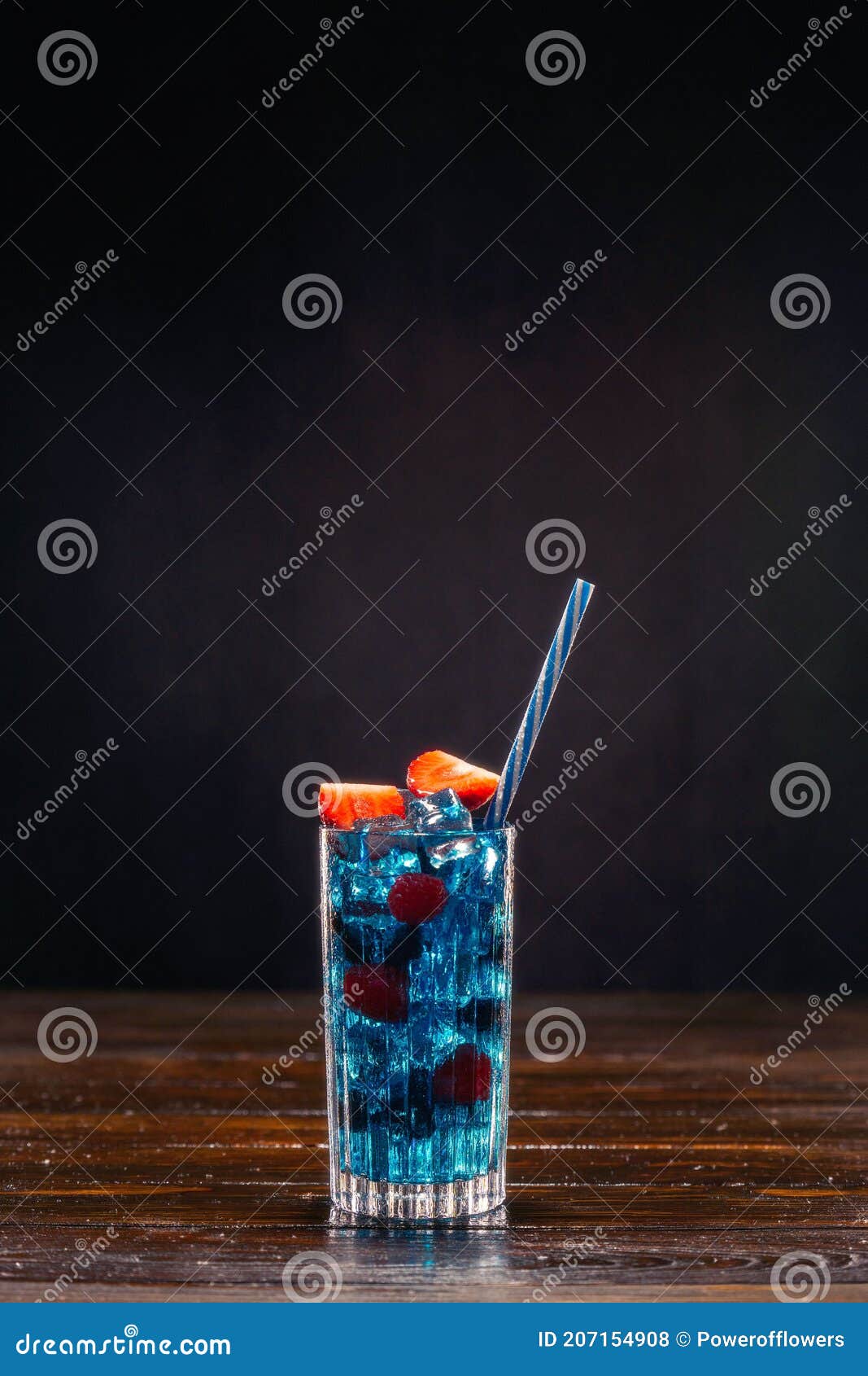 Blue Cocktail and Ice in a Glass Stock Photo - Image of mixed, cocktail ...