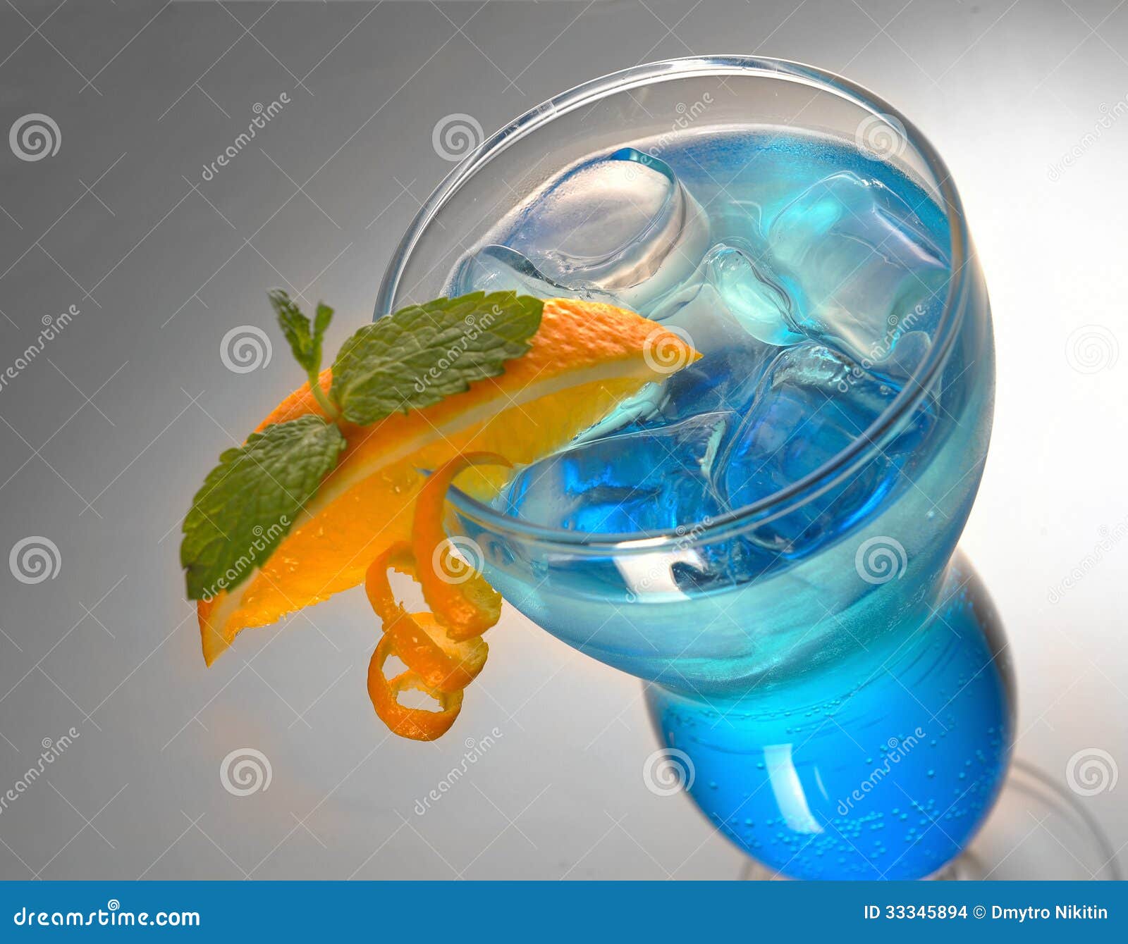 Blue Cocktail with Ice and Orange Stock Photo - Image of crystal ...