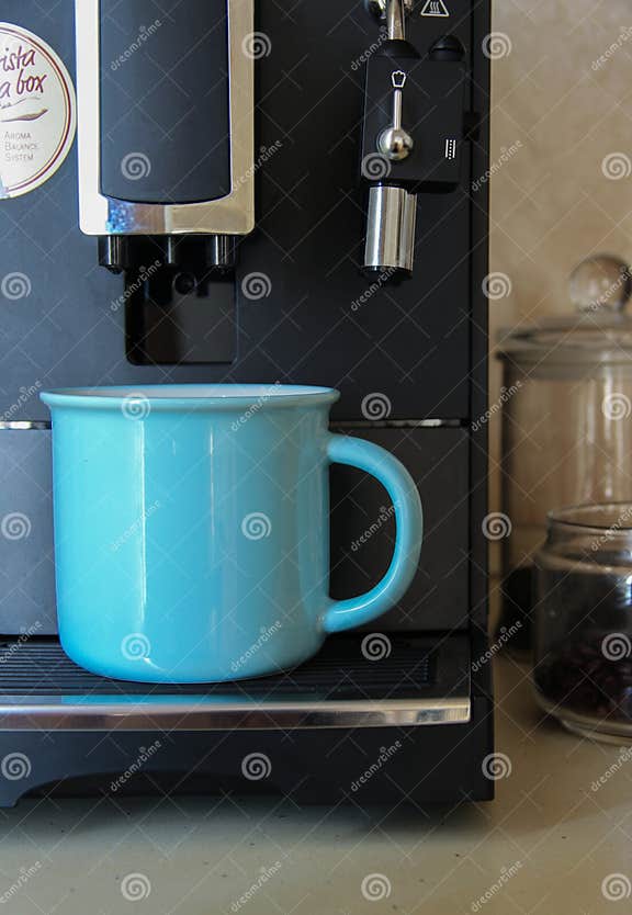 Blue Coffee Mug and Coffee Machine Standing in the Kitchen ...