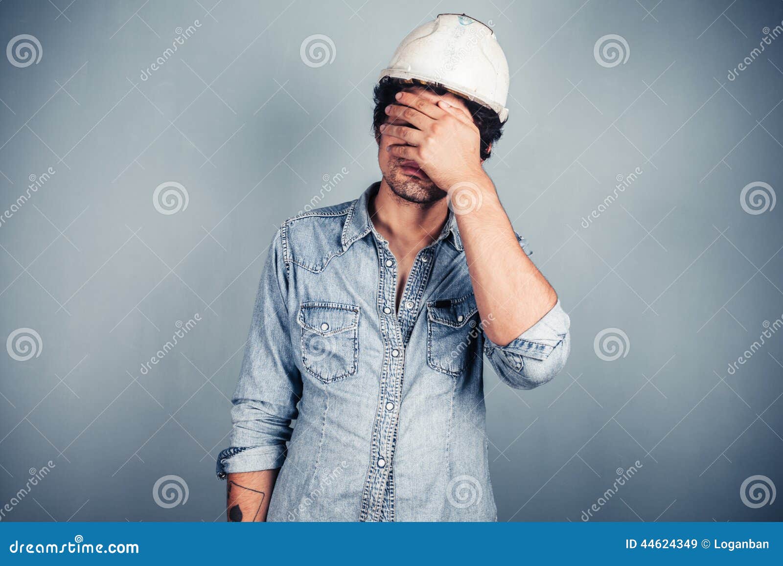 Blue Collar Worker Covering His Face Stock Image - Image of contractor ...