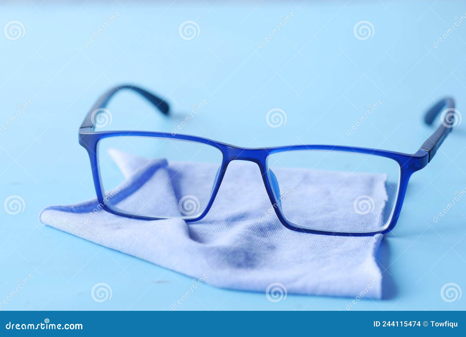 Blue Color Eyeglass and Cleaning Cloths on Table Stock Photo - Image of ...