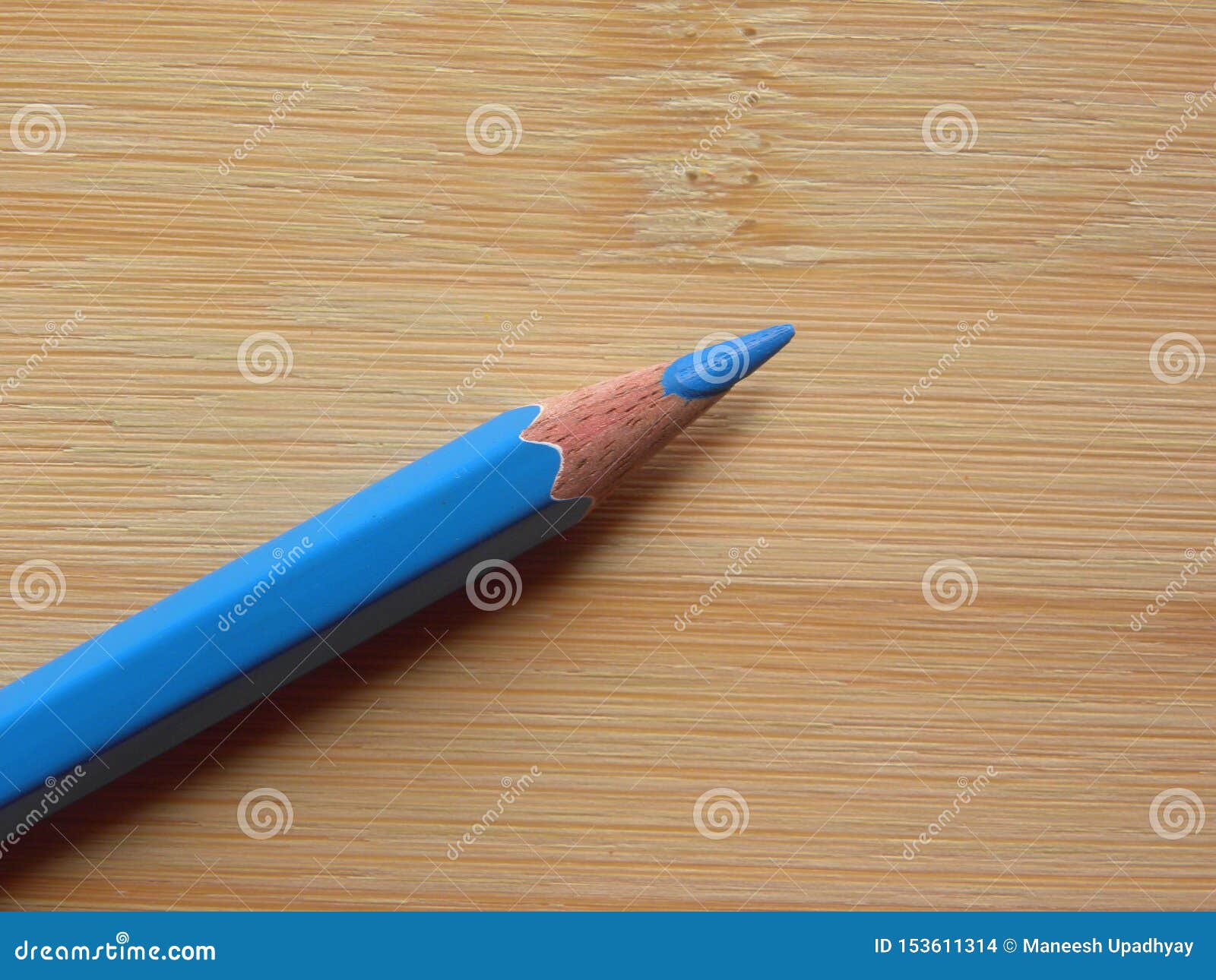 Blue color pencil on table stock photo. Image of colored - 153611314