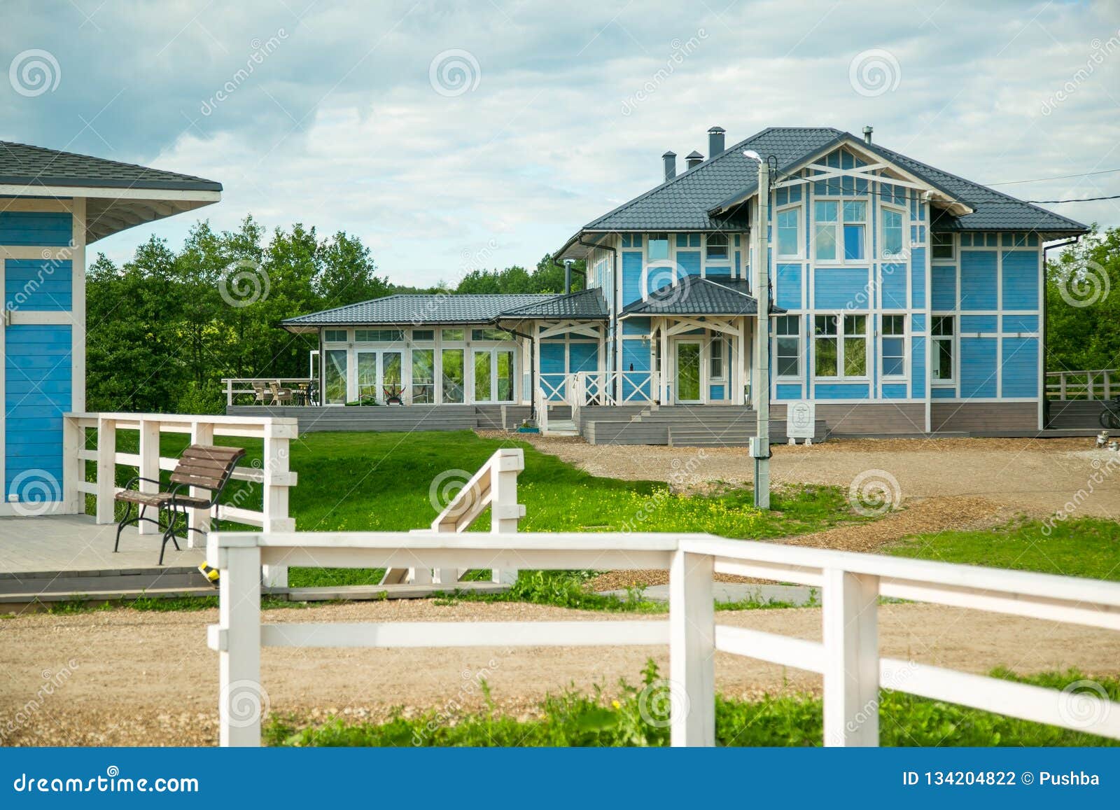 Blue Colored Cottage on the Lake Stock Photo - Image of outdoors, color ...