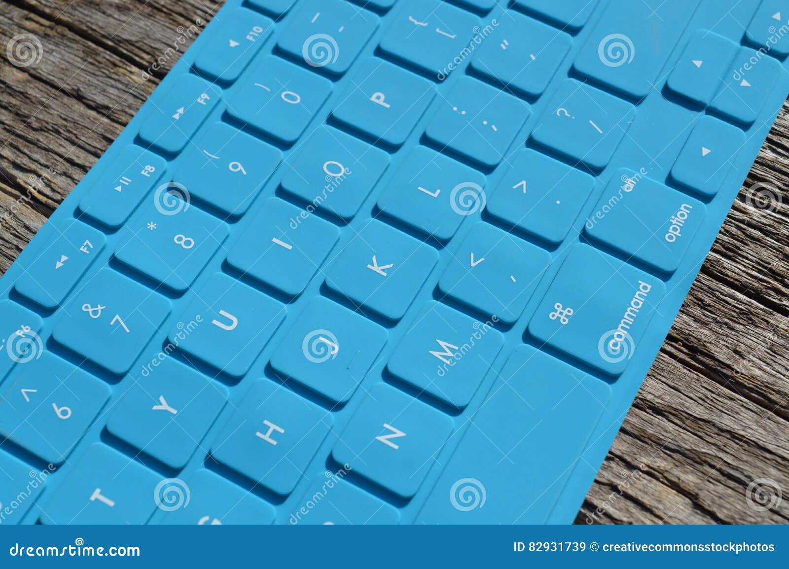 Blue Computer Keyboard On Gray Wooden Surface Picture. Image: 82931739