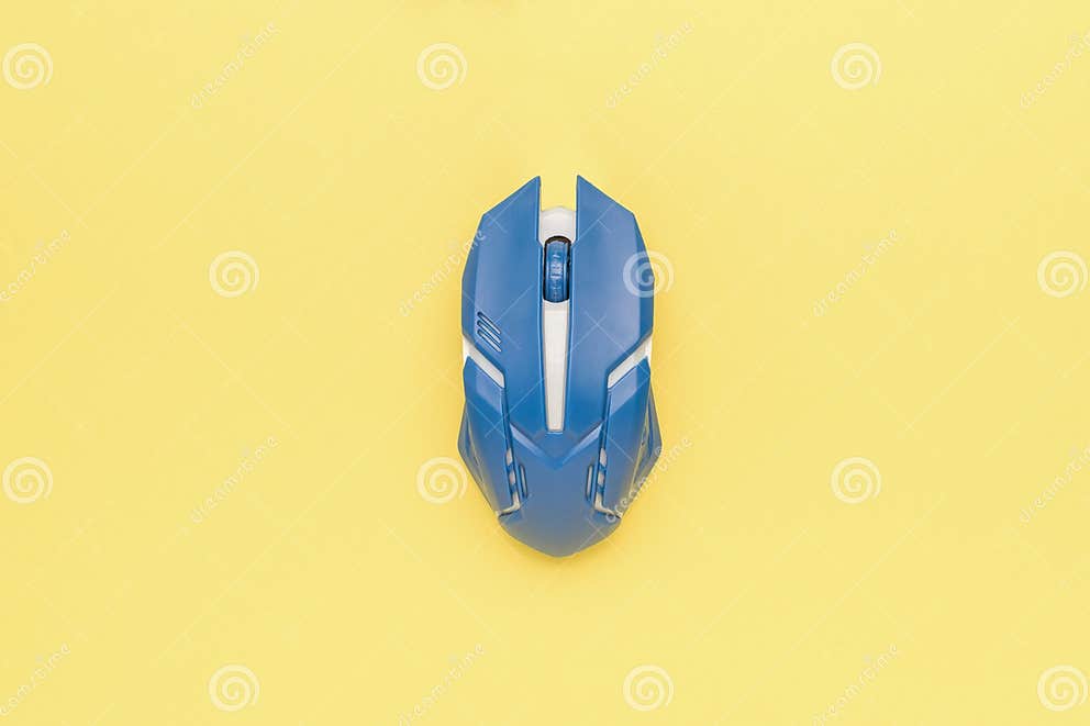 A Blue Computer Mouse on a Yellow Background Stock Image - Image of ...