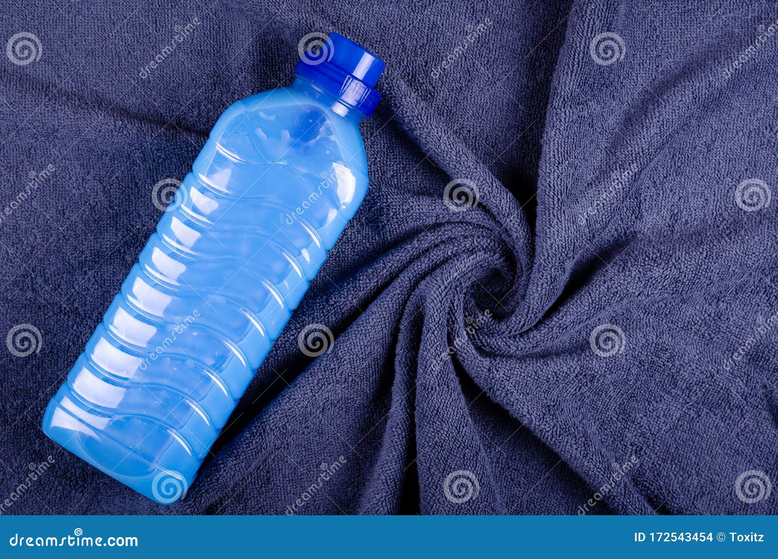 Blue Conditioner in Bottle on Textile Composition Stock Photo - Image ...