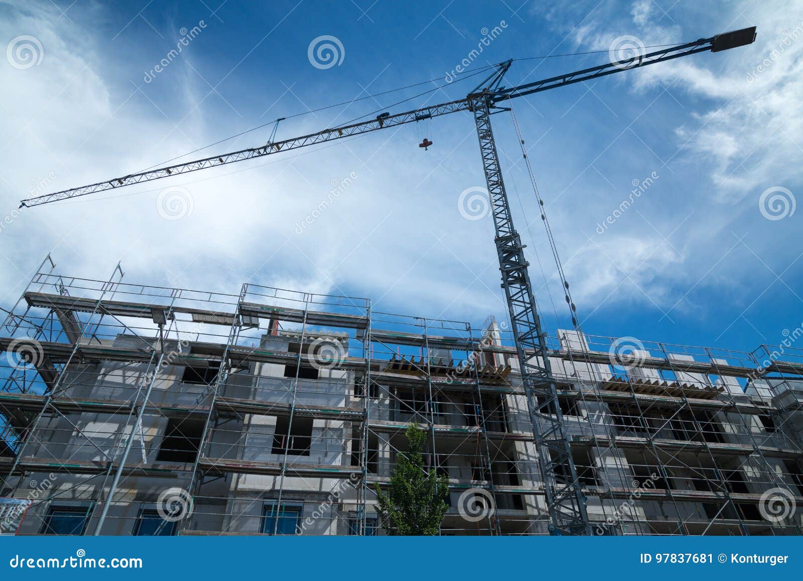 Blue Construction Crane with a New Building in Front Stock Image ...