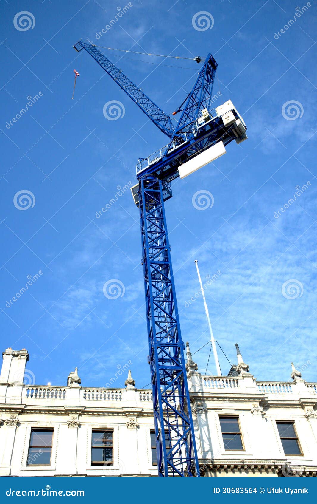 Blue Crane Tower Next To a Building Stock Photo - Image of blue, fund ...