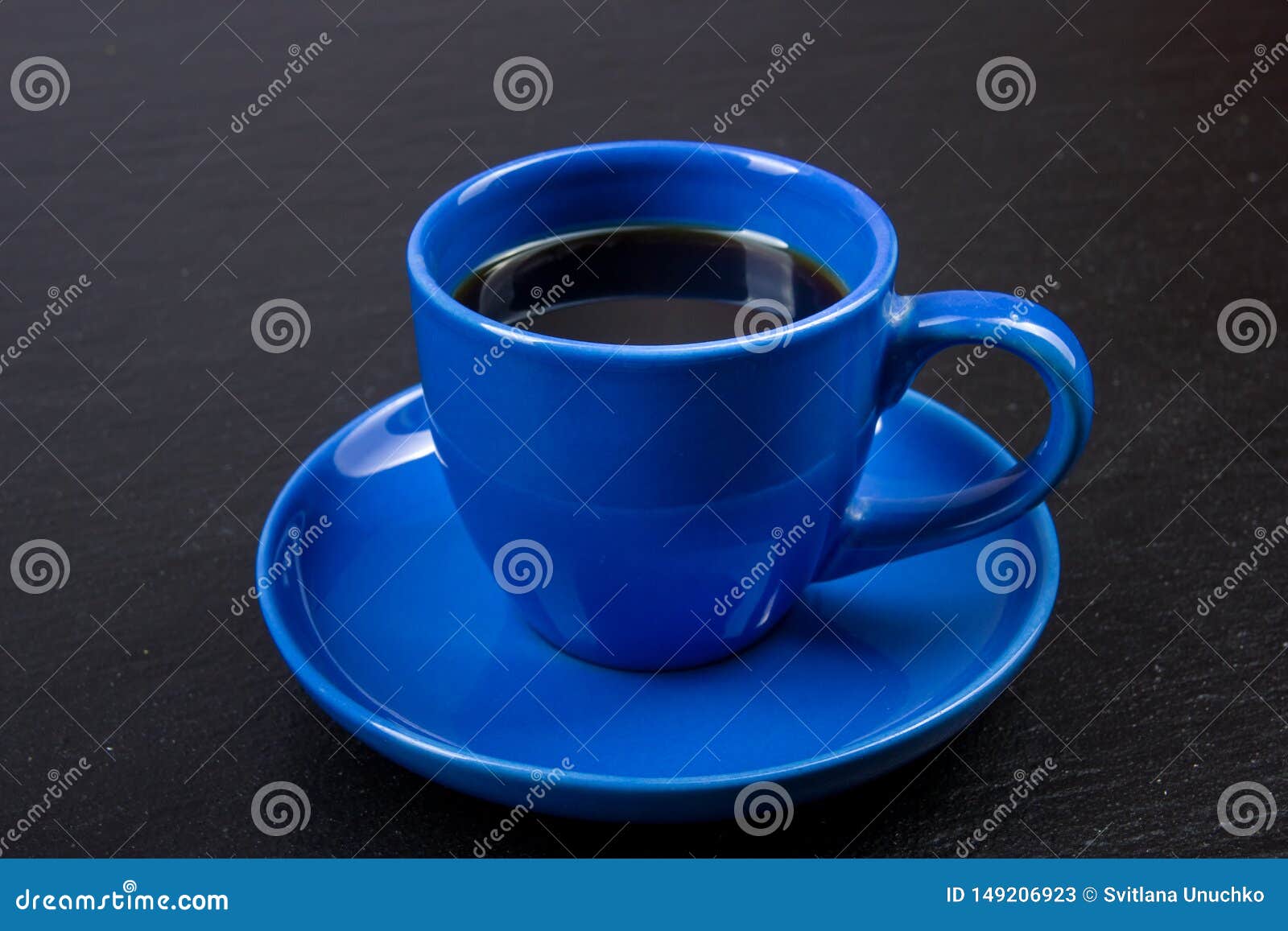 Blue Cup of Coffee on Black Wooden Background. Stock Image - Image of ...