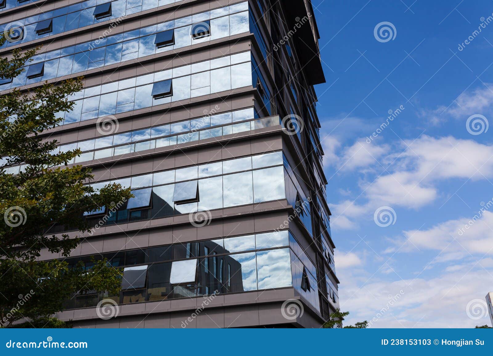 Blue Curtain Wall Made of Toned Glass and Steel Constructions Under ...