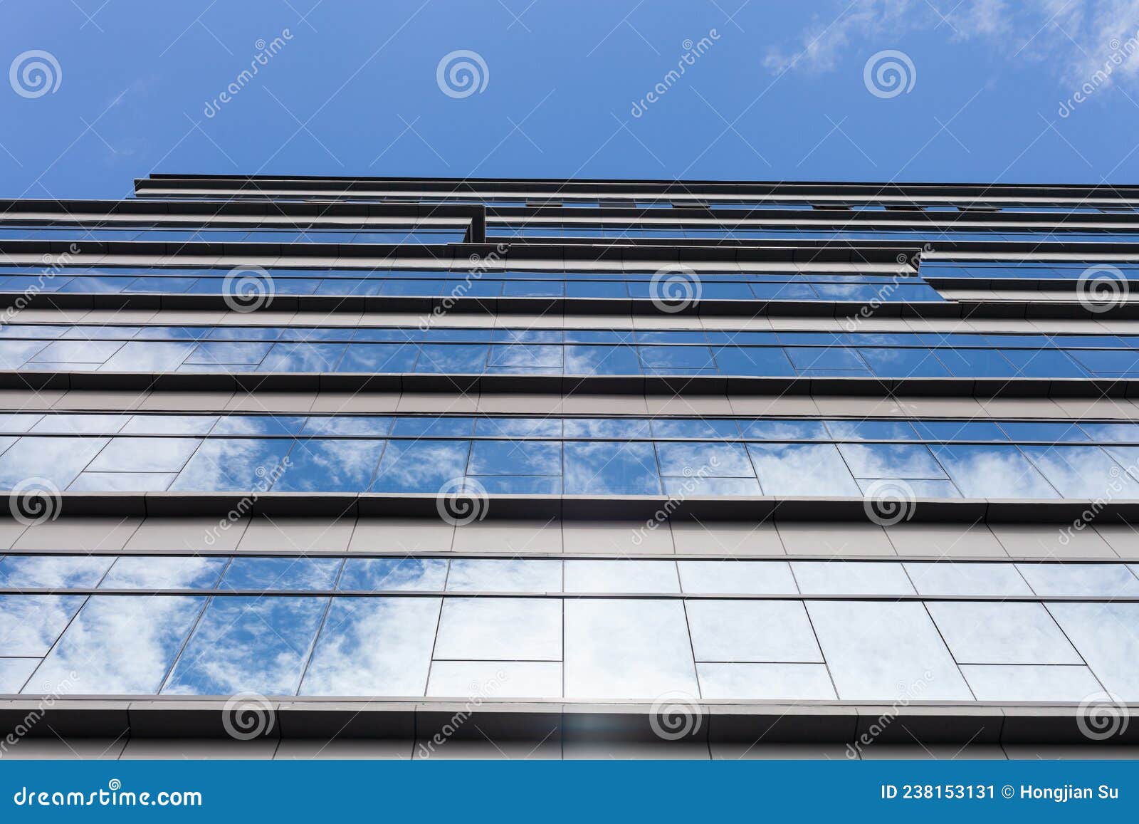 Blue Curtain Wall Made of Toned Glass and Steel Constructions Under ...