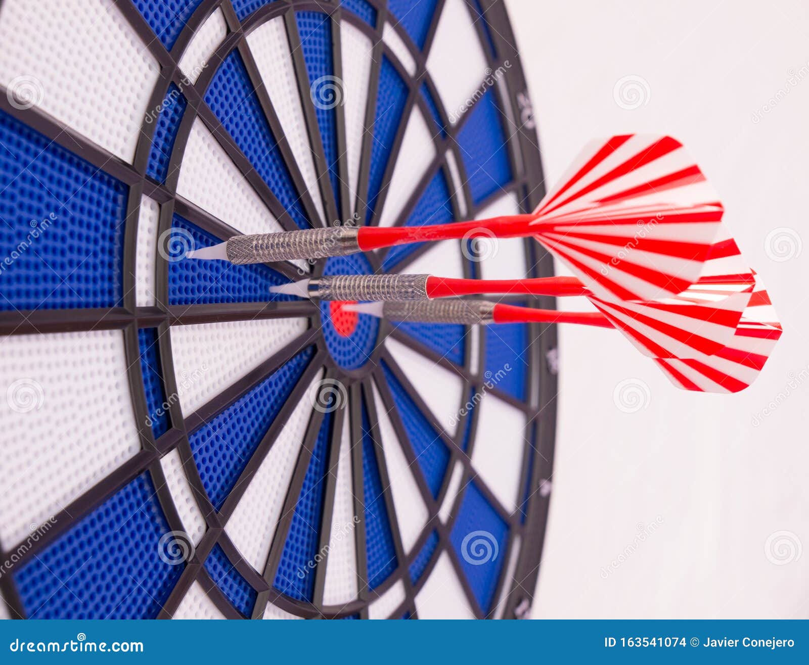 Blue dartboard with darts stock photo. Image of object - 163541074