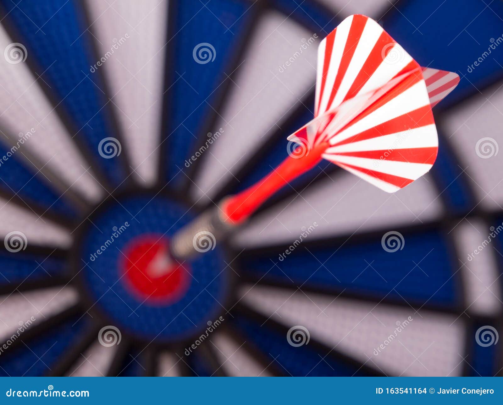 Blue dartboard with darts stock photo. Image of center - 163541164