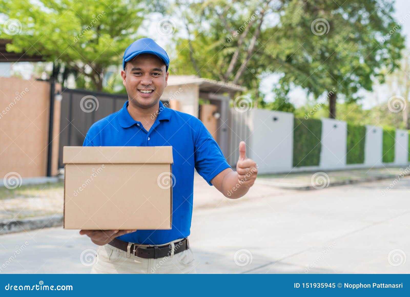 Blue Delivery Man Holding Parcel Cardboard Box Stock Image - Image of ...