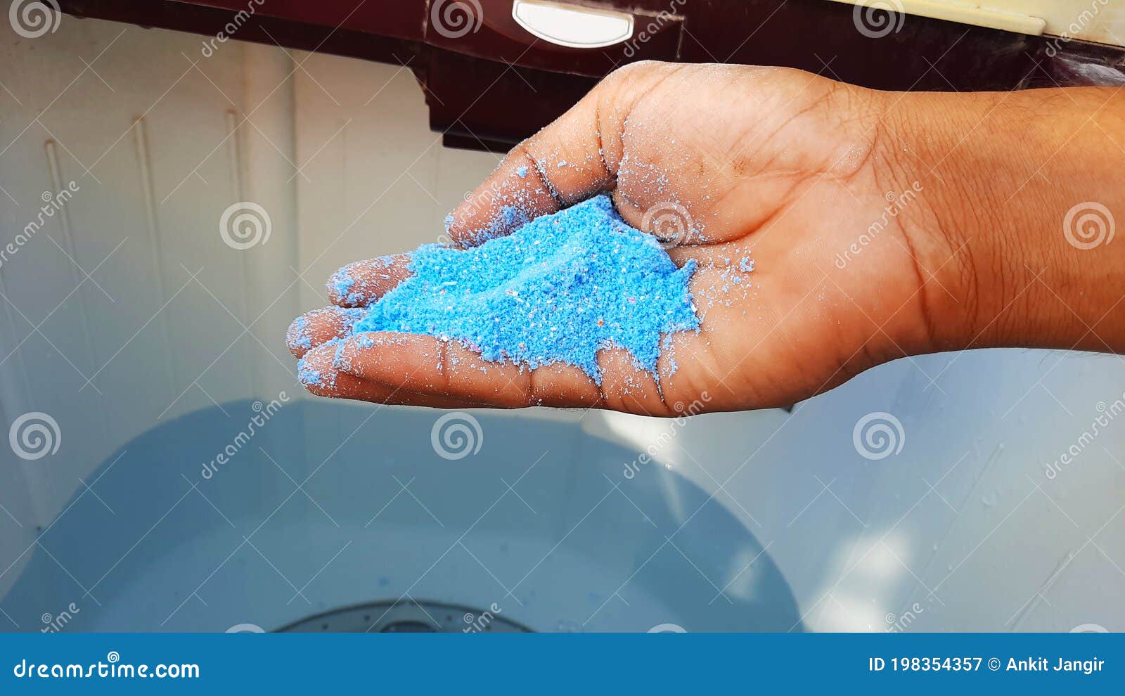 Blue Detergent Powder in Hands and Adding it in Water in Washing ...