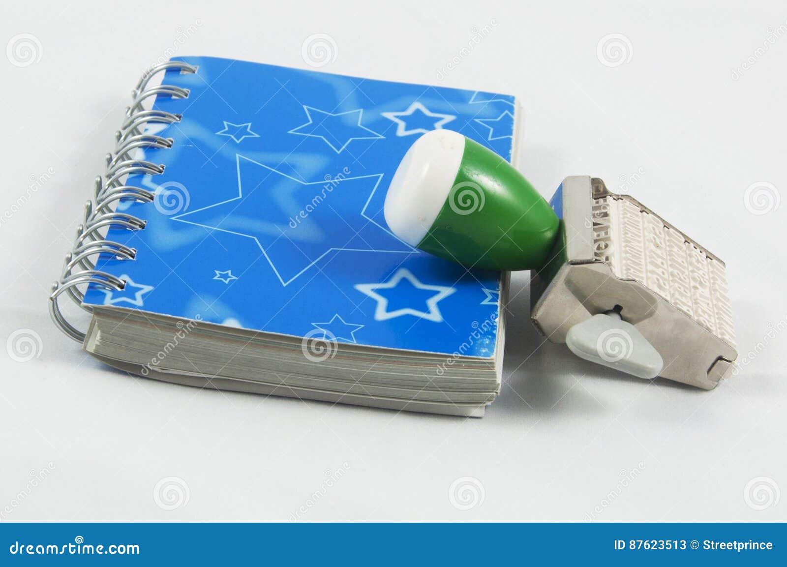 A blue diary and a stamp stock image. Image of fountain - 87623513