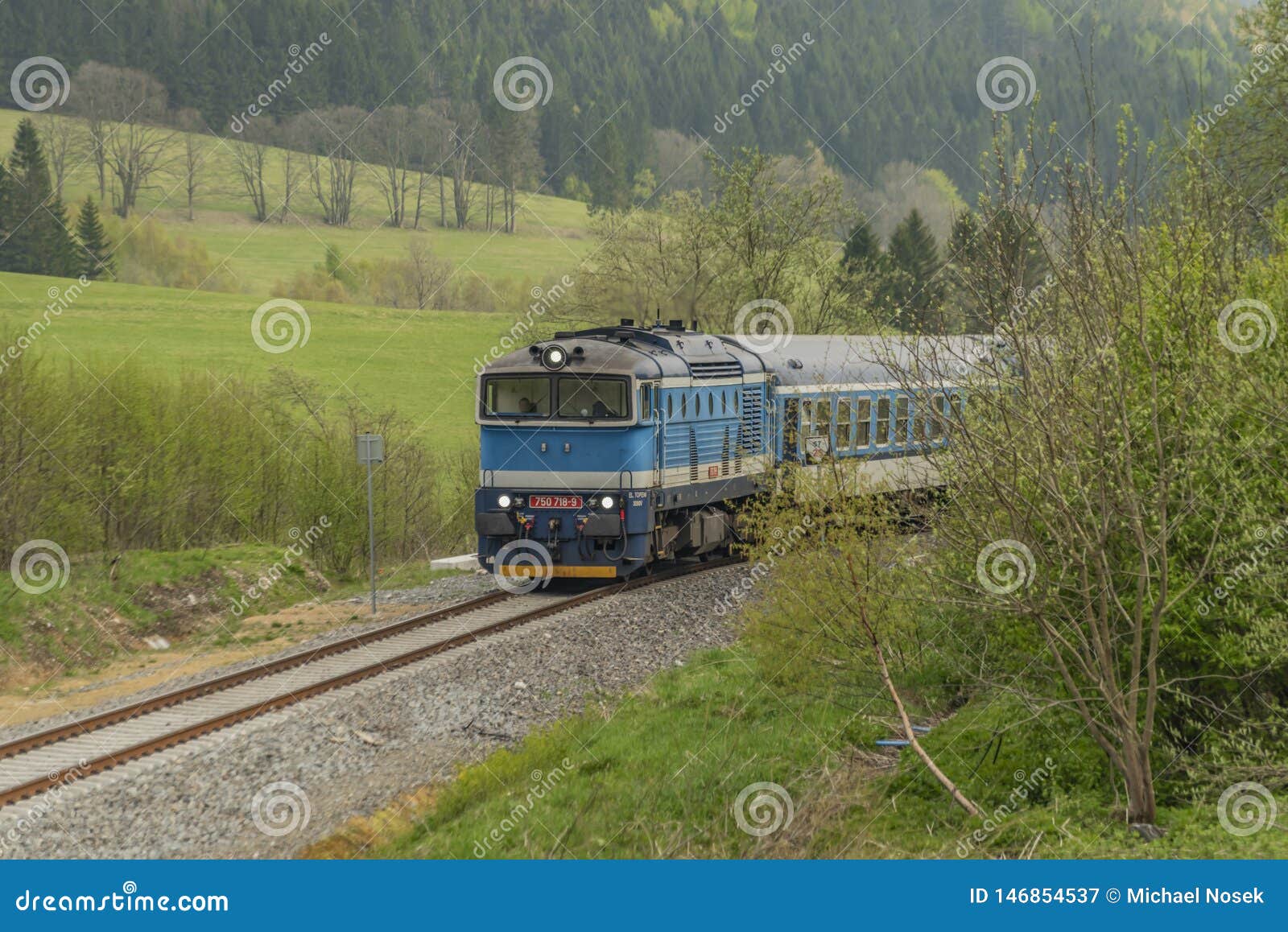 Blue Diesel Train with Passengers Coach in Jeseniky Mountains Editorial ...