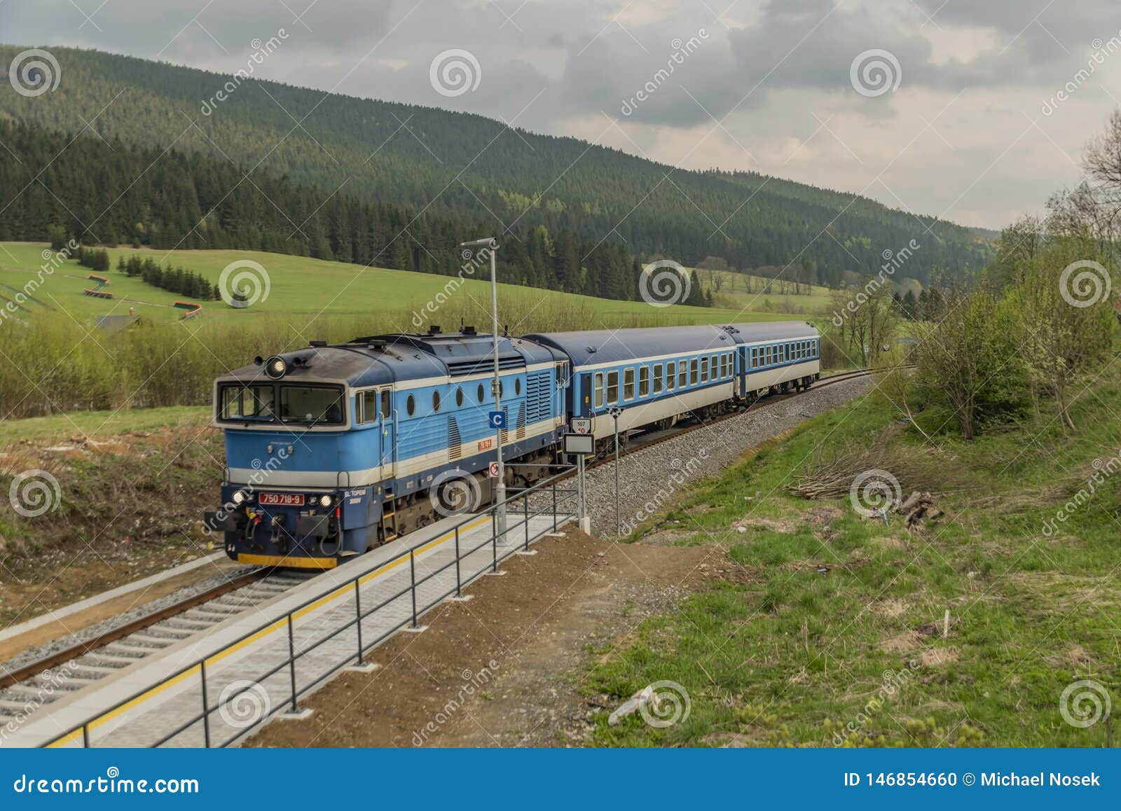 Blue Diesel Train with Passengers Coach in Jeseniky Mountains Editorial ...