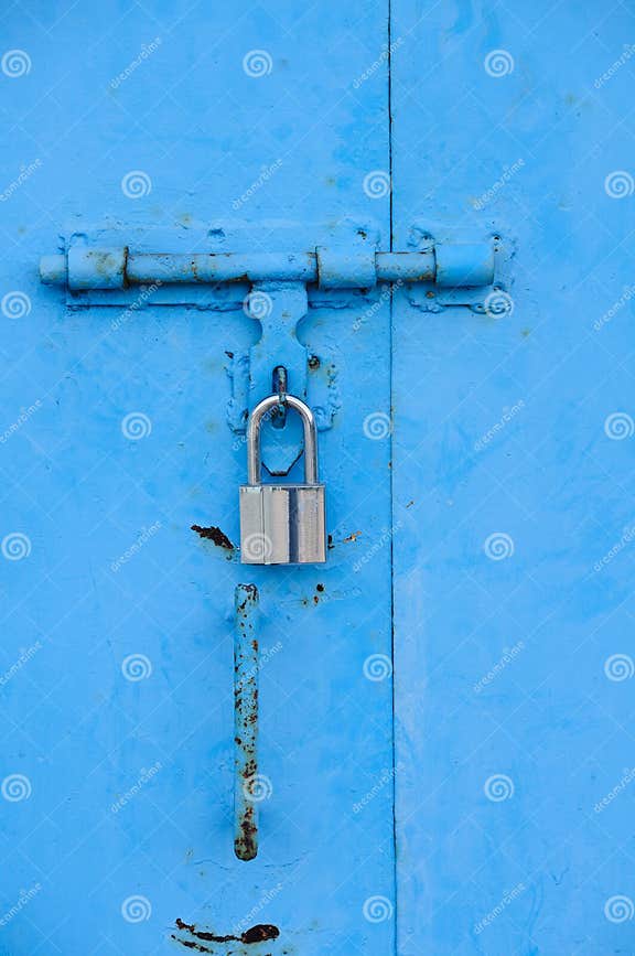 Blue door and lock stock image. Image of grungy, closed - 7409259