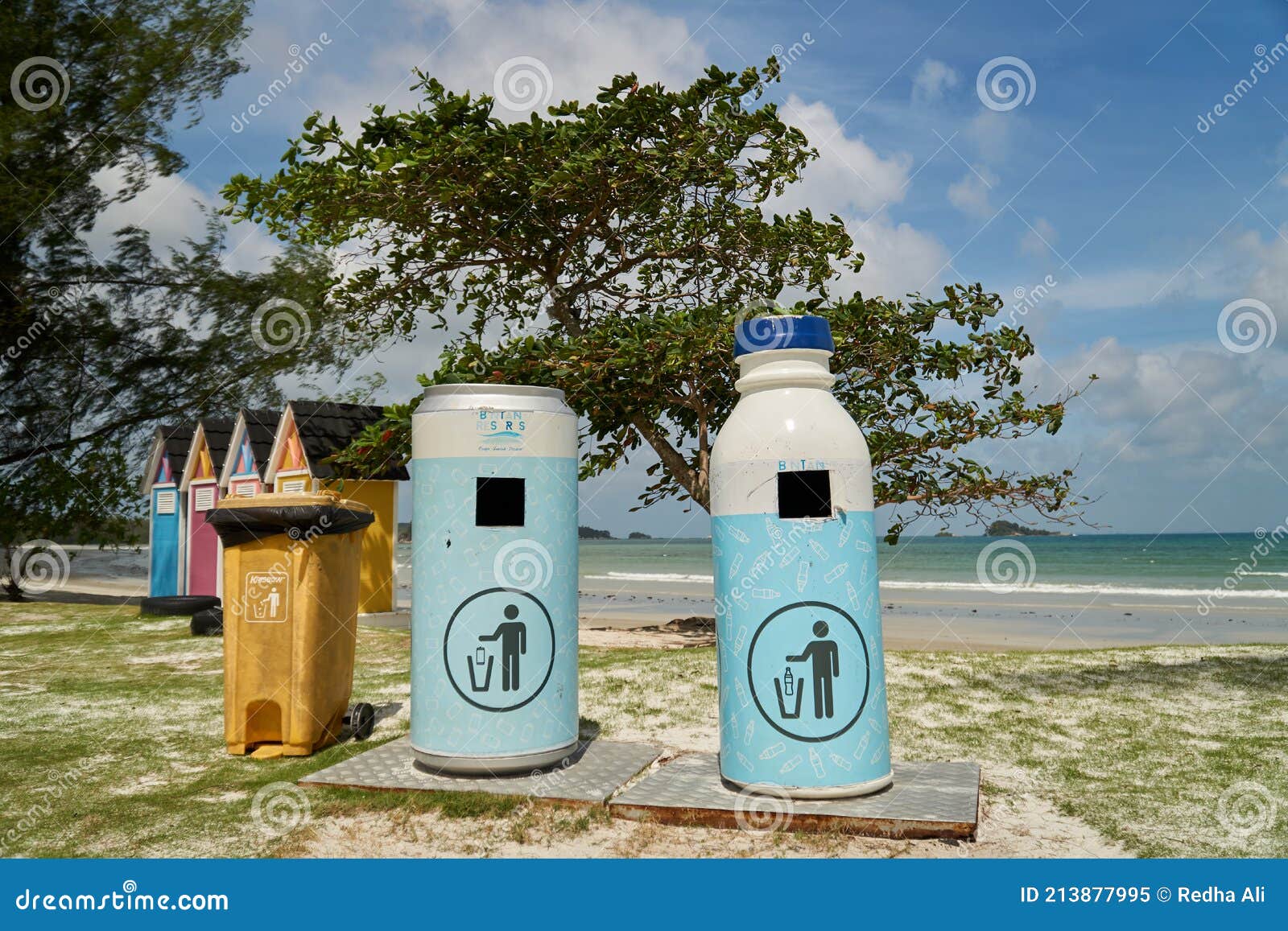 Blue dustbin by the beach stock image. Image of green - 213877995