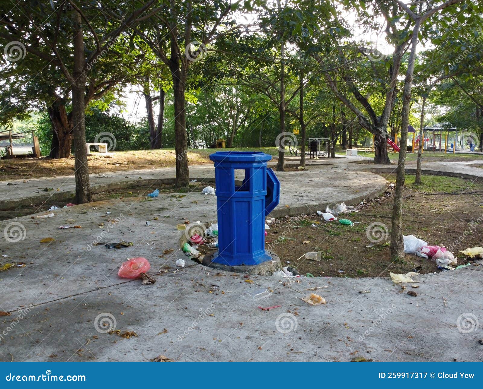 Blue dustbin at the park stock image. Image of trash - 259917317
