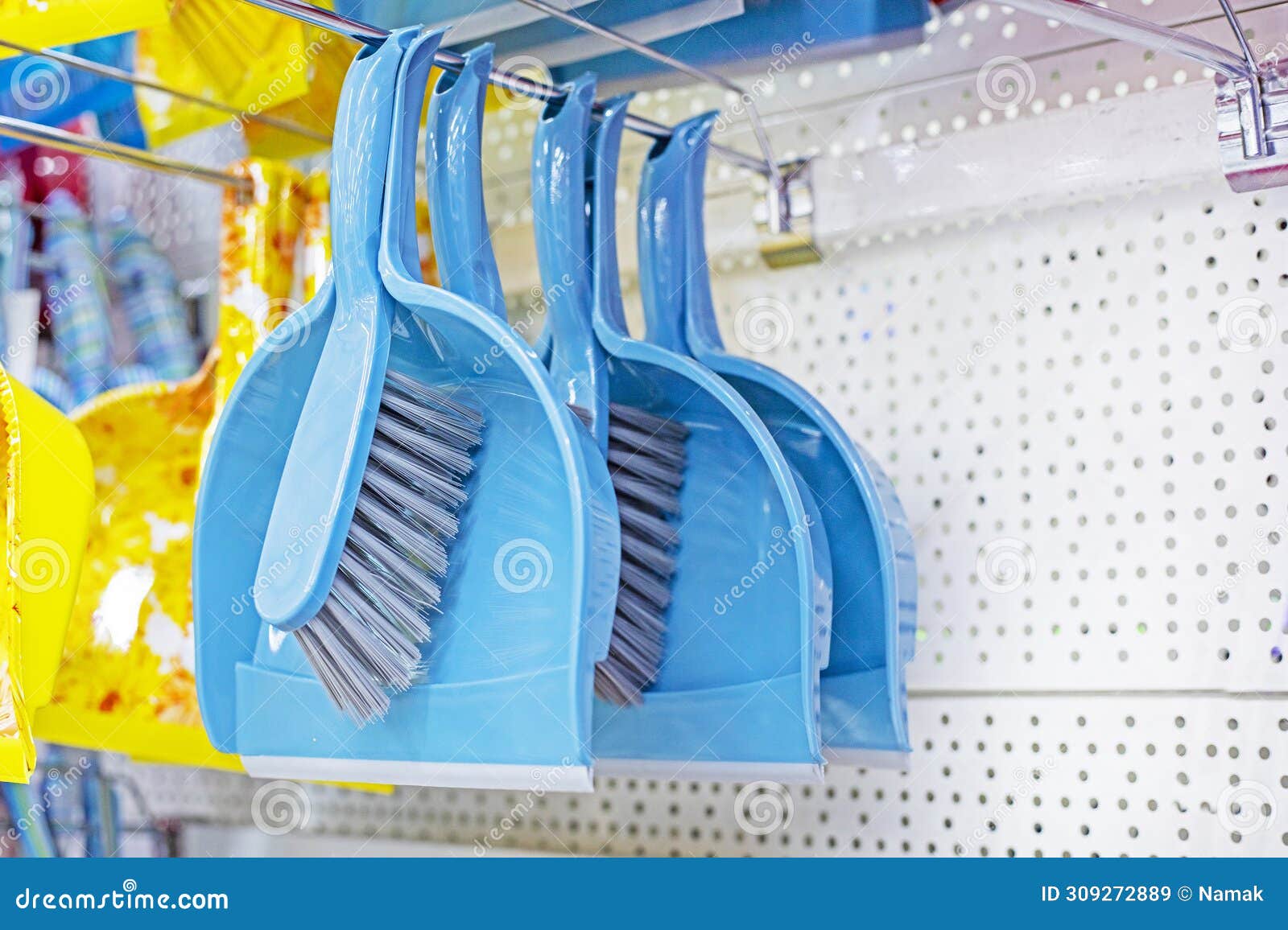Blue Dustpan and Broom Sets for Cleaning in a Supermarket Display Case ...