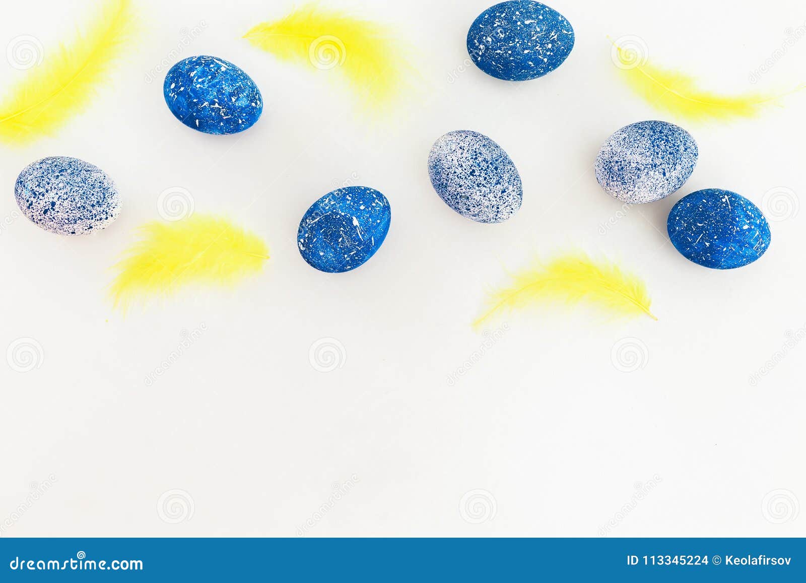 Blue Easter Eggs and Bright Yellow Feather on White Background. Flat Lay, Top View Stock Photo ...