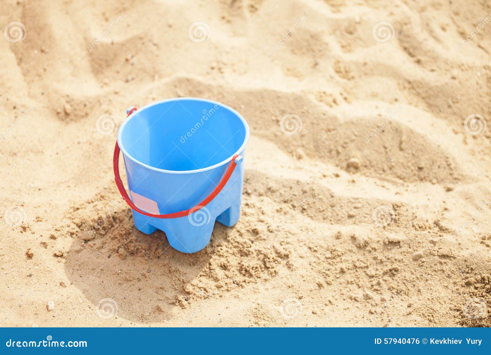 Blue Empty Bucket with Red Handle on Sand Stock Photo - Image of ...