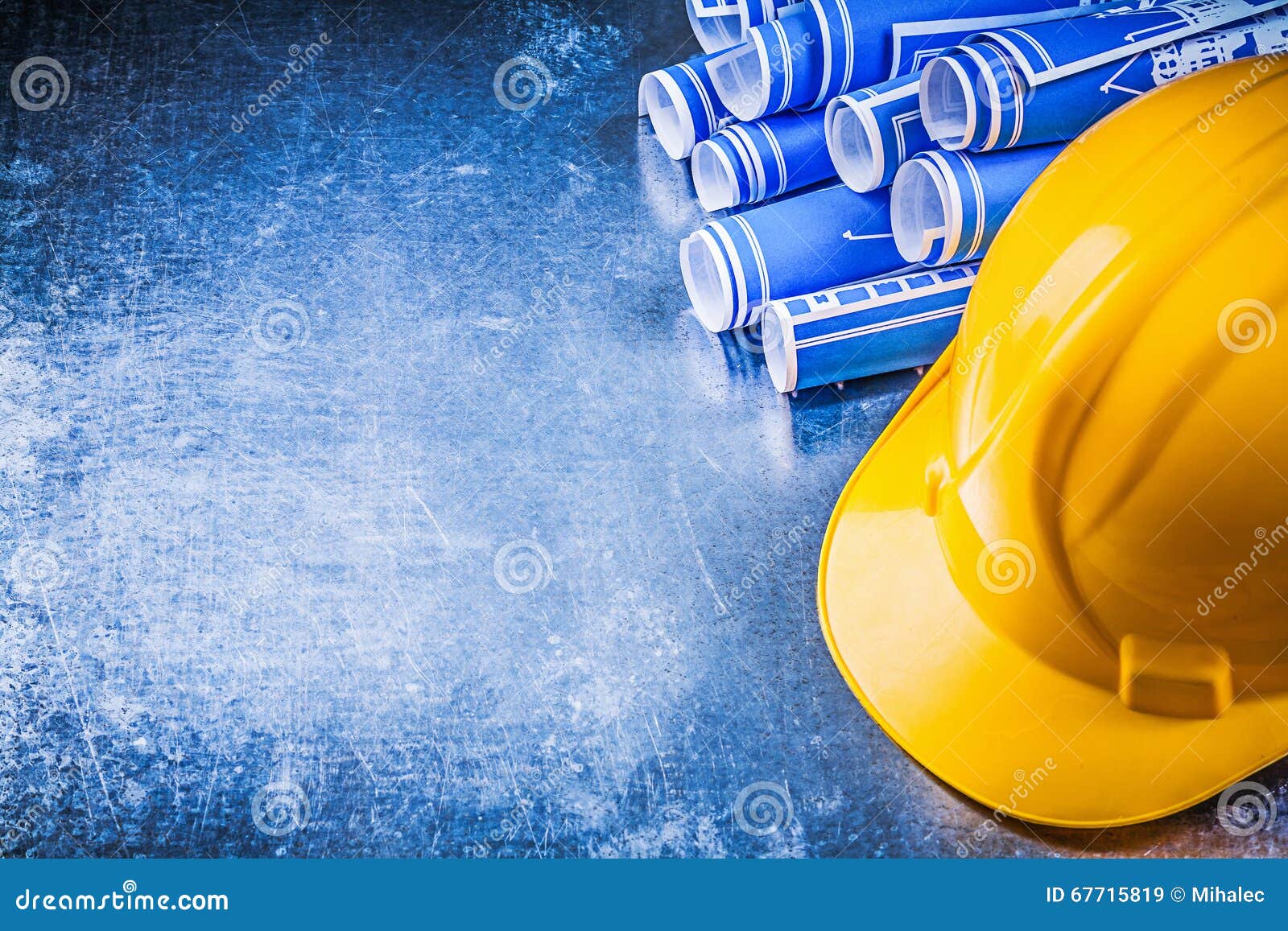 Blue Engineering Drawings Yellow Hard Hat on Scratched Metallic Stock ...