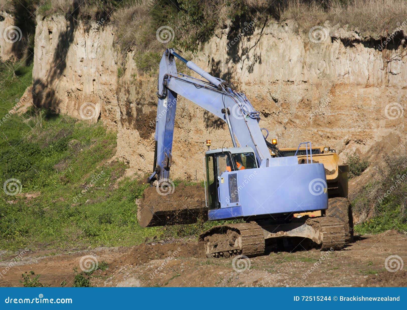 Blue excavator digging stock photo. Image of excavating - 72515244