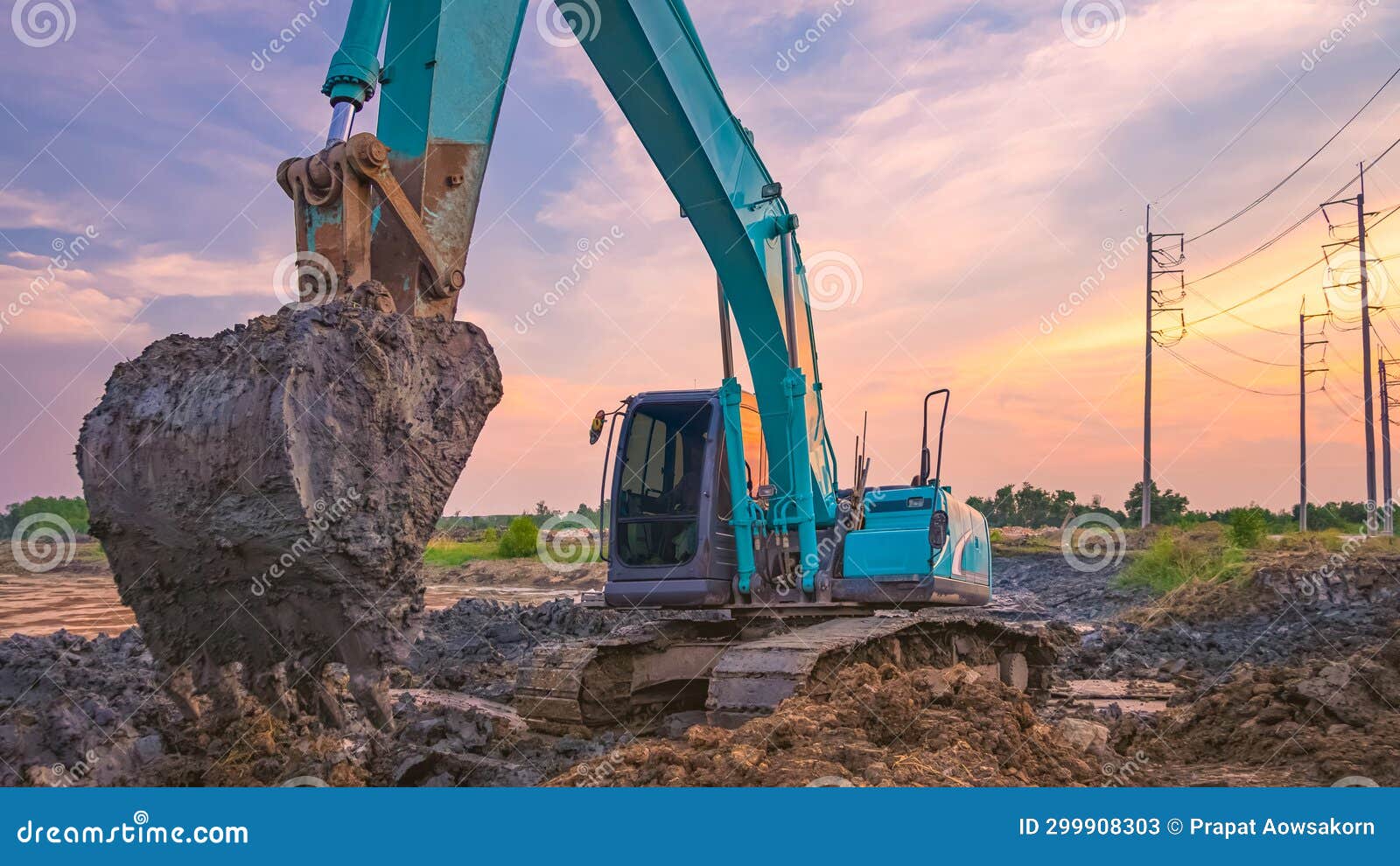 Blue Excavator is Leveling the Ground in Construction Site Against ...