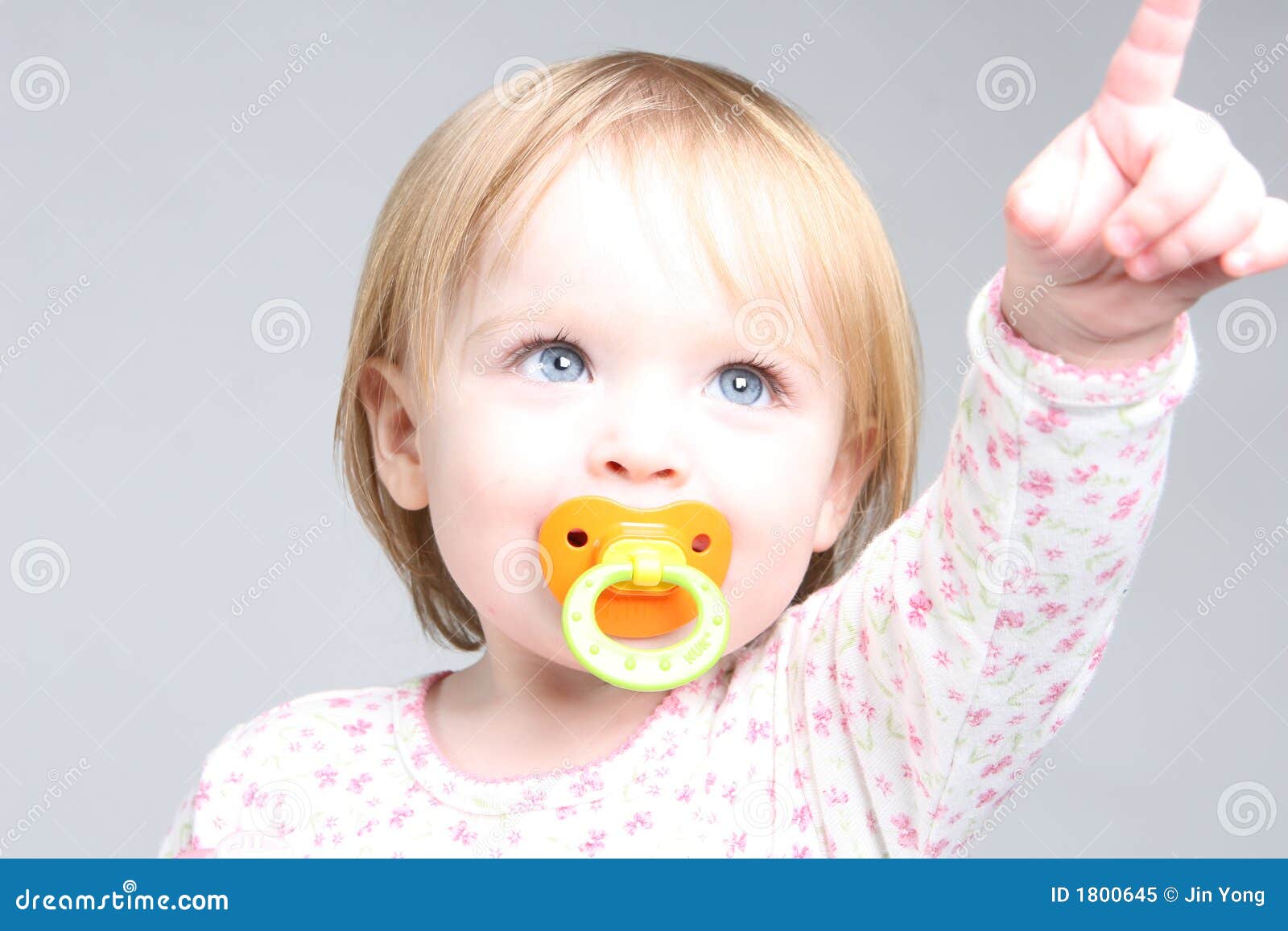 Blue eye baby pointing up stock image. Image of infant - 1800645