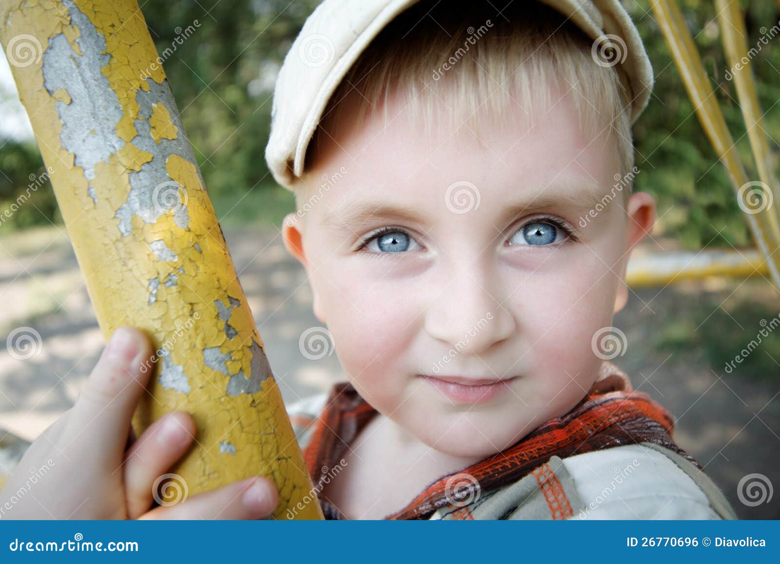Blue-eyed boy in the park stock photo. Image of human - 26770696