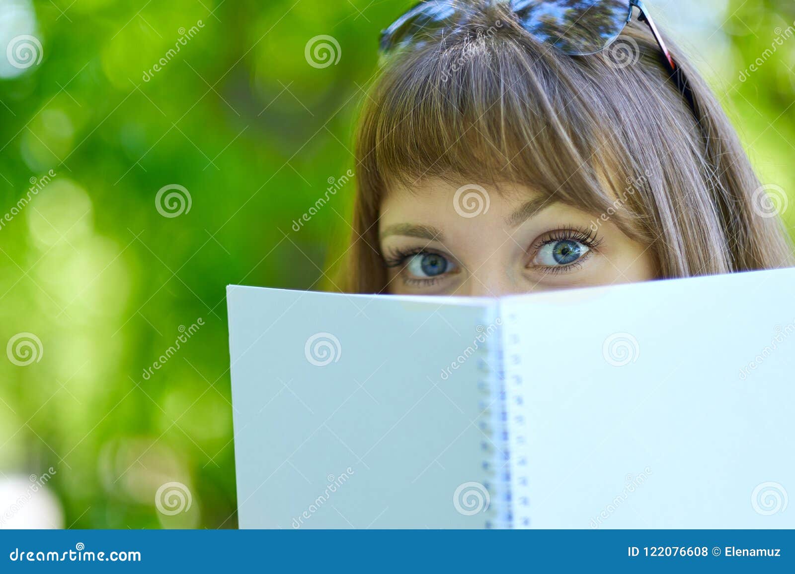 Blue Eyed Female Student is Hiding Behind a Book. Student Hiding Behind ...