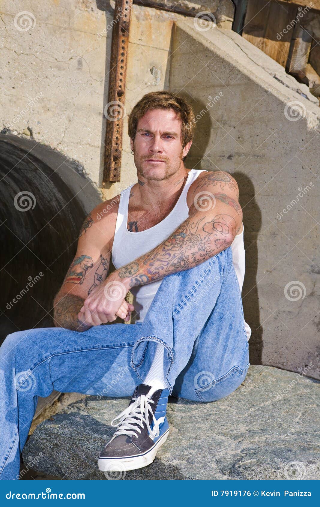 Blue Eyed Man with Tattoos stock photo. Image of muscles - 7919176